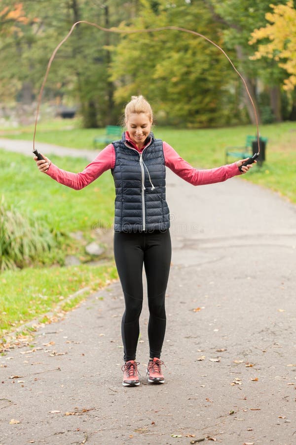 Woman Training on Jumping Rope in Park Stock Image - Image of ...