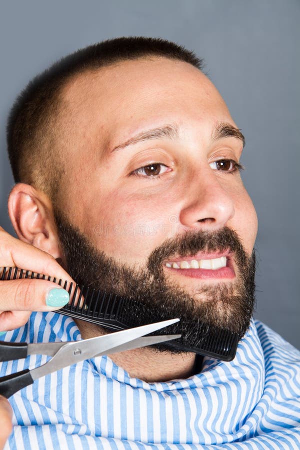 Woman is Trimming the Beard of a Young Man Stock Photo - Image of ...