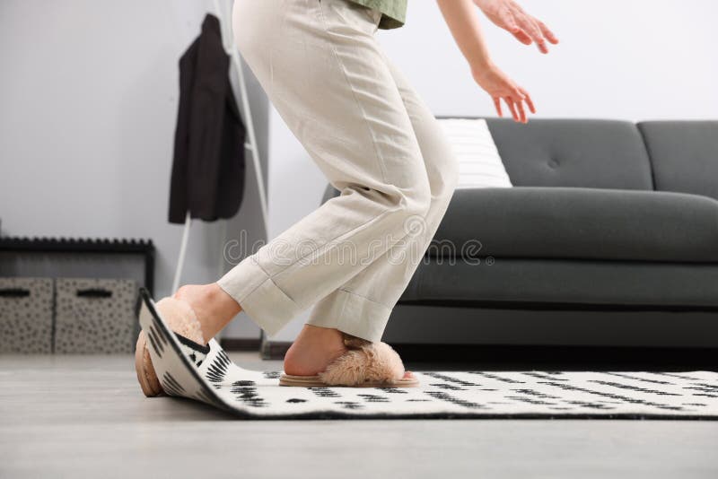Woman Tripping Over Carpet at Home, Closeup Stock Image - Image of ...