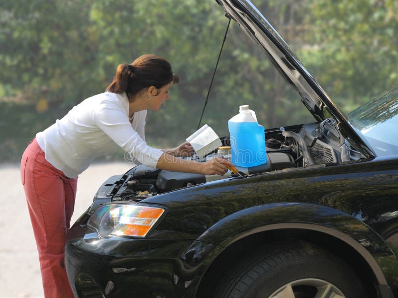 Woman Trying To Fix the Car Stock Photo - Image of reading, manual: 3502410