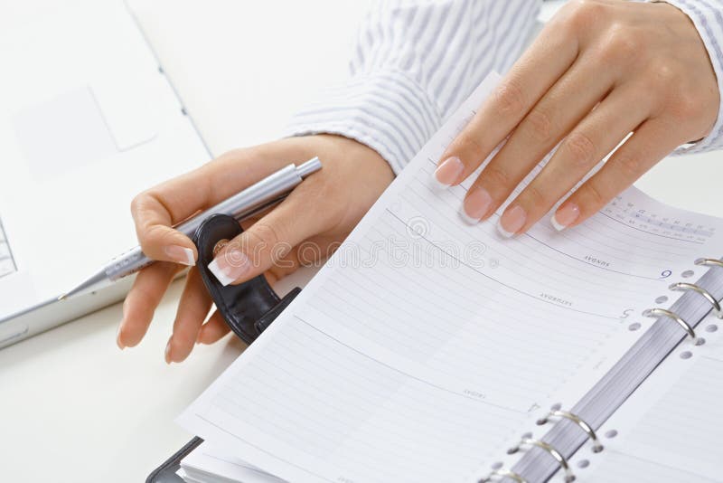 Woman Turning Notebook Page Stock Image - Image of horizontal, bright ...
