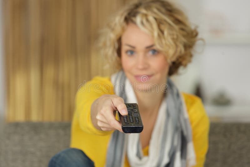 Woman with Tv Remote Control on Sofa Stock Photo - Image of indoor ...