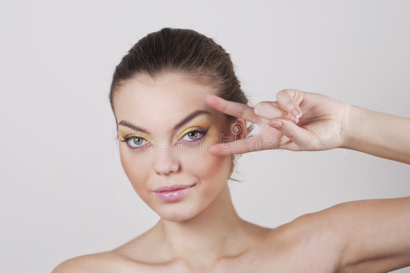 123 Woman Two Fingers Near Her Face Stock Photos - Free & Royalty-Free Stock Photos from Dreamstime