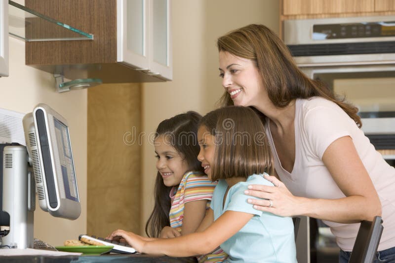 Woman and Two Young Children with Computer Stock Image - Image of ...
