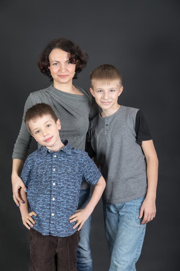 Woman with two sons stock photo. Image of love, parents - 60588754