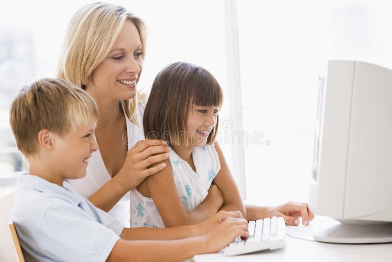Woman and Two Young Children with Computer Stock Image - Image of ...