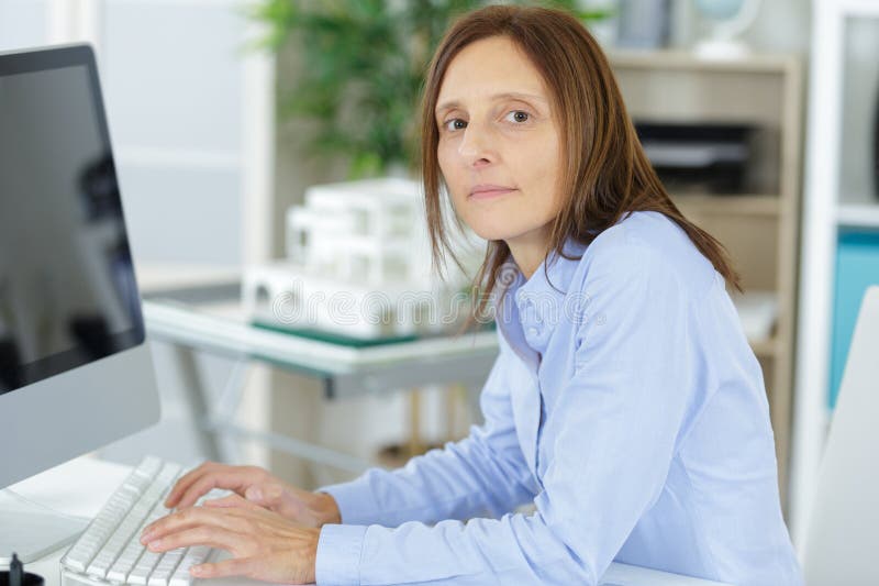 Woman typing on keyboard stock photo. Image of online - 207980744
