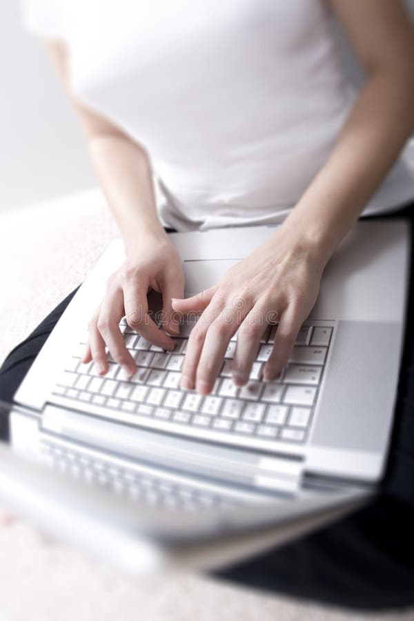 Woman typing on laptop stock image. Image of modern, sitting - 3283203