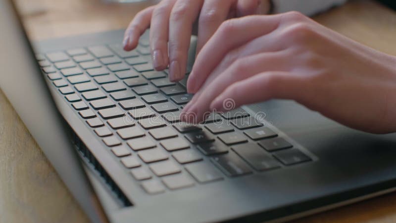 Woman Typing on Laptop Keyboard in the Office. Close Up Woman Hands ...