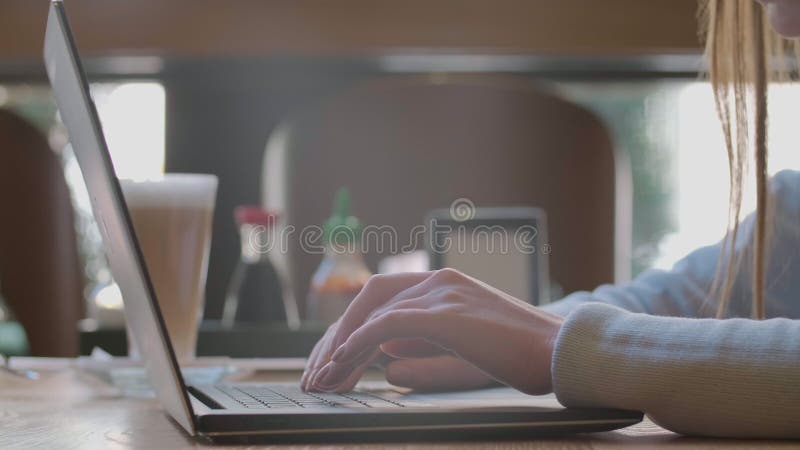 Close Up Hands Of Woman Sitting At Desk Typing Computer Code On Laptop Keyboard Lines Of
