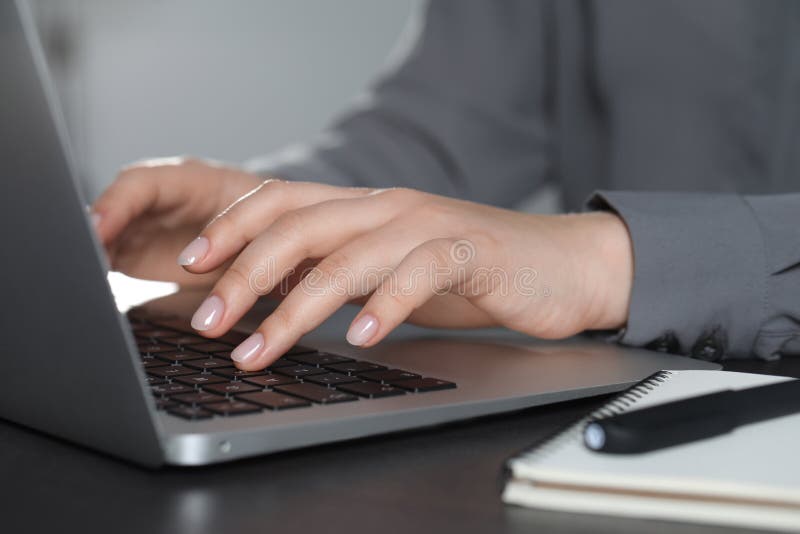 Woman Typing on Laptop at Table, Closeup. Electronic Document ...