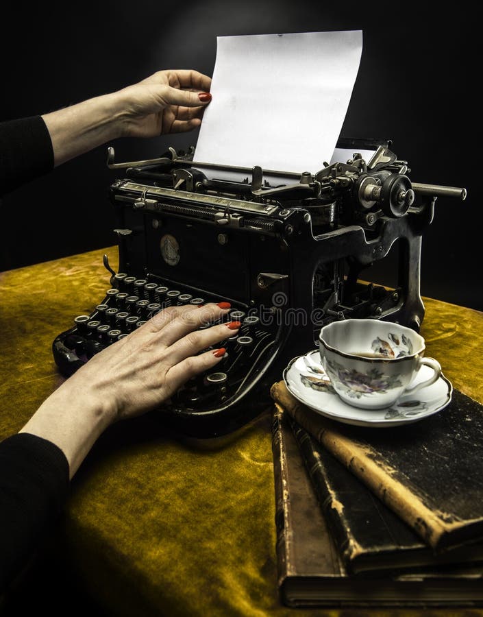 Woman Typing on a Old Typewriter Stock Photo - Image of desaturated ...