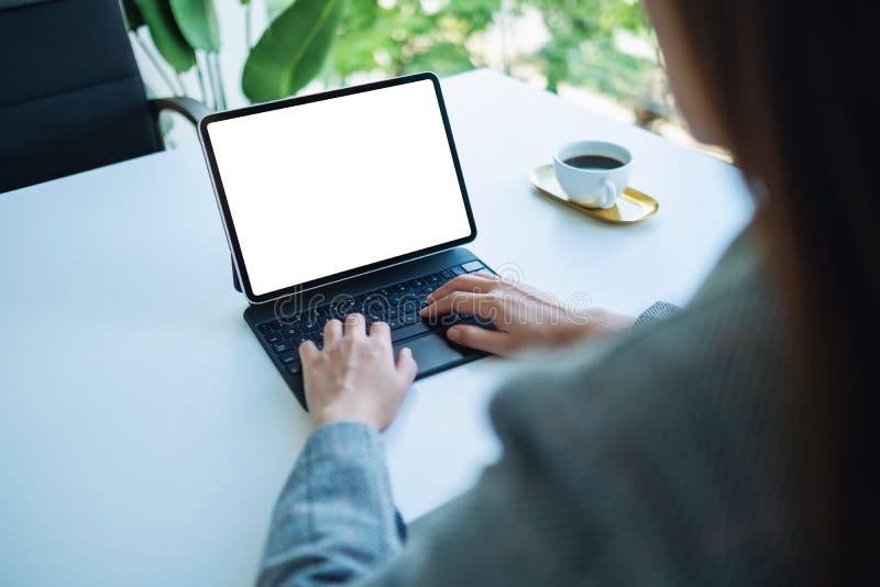 A Woman Typing on Tablet Keyboard with Blank White Desktop Screen As a ...