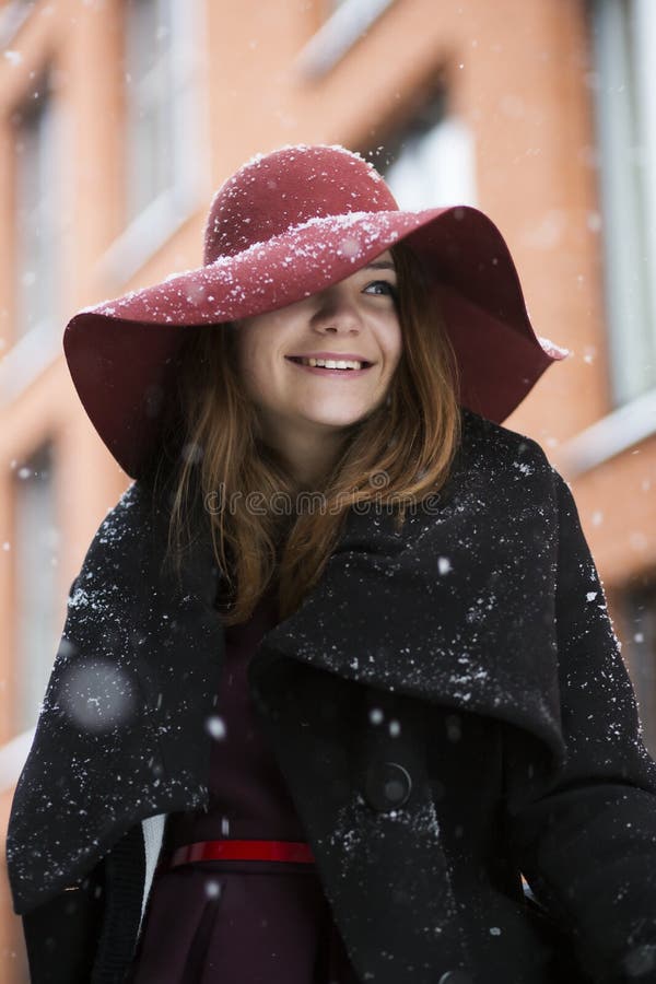 Woman Under Light Snowfall Look at Left Stock Photo - Image of cold ...