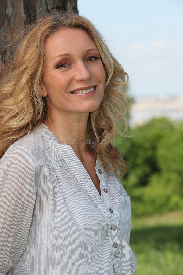 Woman under a tree stock photo. Image of female, tree - 31379170