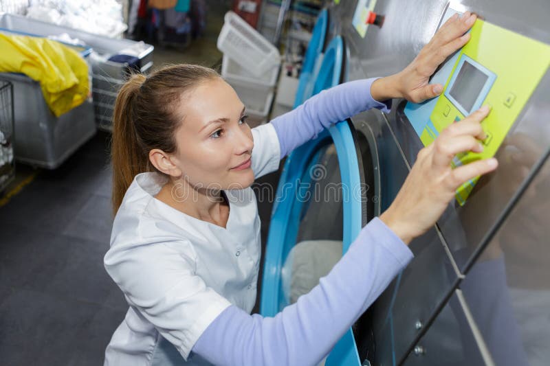 Woman in Uniform in Professional Laundry Stock Photo - Image of garment ...