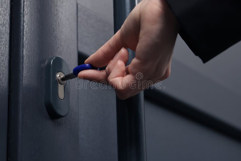 Woman Unlocking Door with Key, Closeup View Stock Image - Image of ...