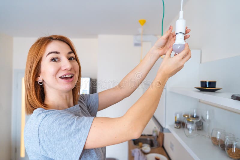 Woman Unscrew a Light Bulb To Light Does Not Light Stock Photo - Image ...