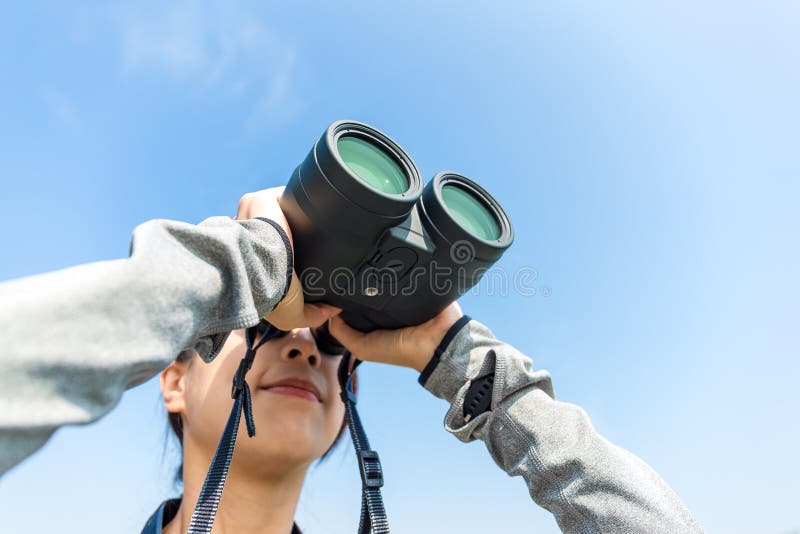 Woman use binoculars stock image. Image of blue, japanese - 64749575