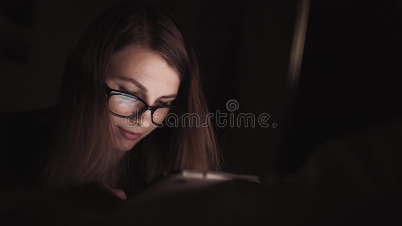 Woman Use of Mobile Phone and Lying on Bed at Night Stock Image - Image ...