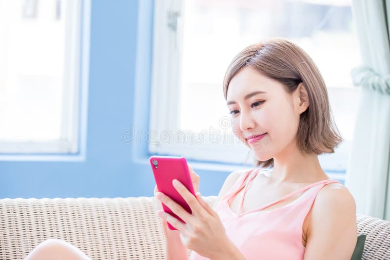 Woman use phone happily stock image. Image of asia, phone - 127402291