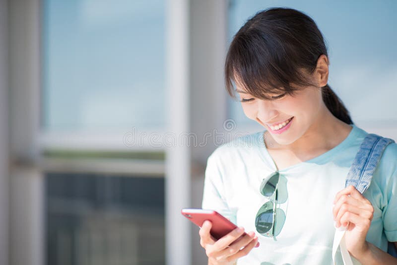 Woman use phone happily stock image. Image of social - 131054699