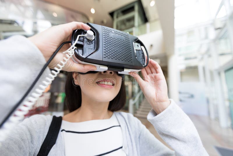 Woman use of VR device stock image. Image of headset - 94617699