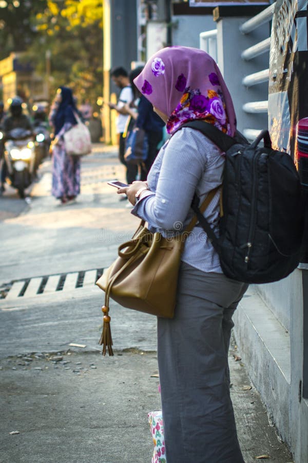 Woman Uses Her Mobile Phone on the Street Editorial Stock Photo - Image ...