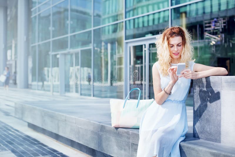 Woman Using App on Her Phone Stock Photo - Image of cute, cheerful ...