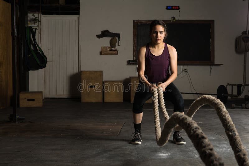 Woman Using Battle Ropes for Working Out Stock Image - Image of workout ...