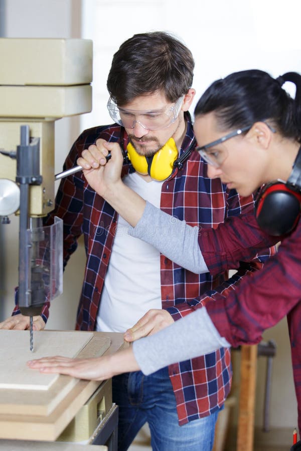 Woman Using Bench Drill Under Supervision Stock Image - Image of ...