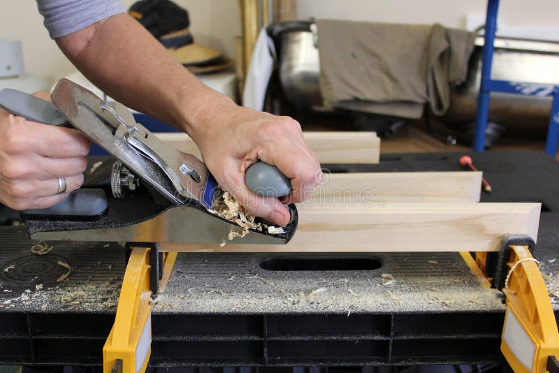 Woman using bench plane stock photo. Image of close, builder - 74035978