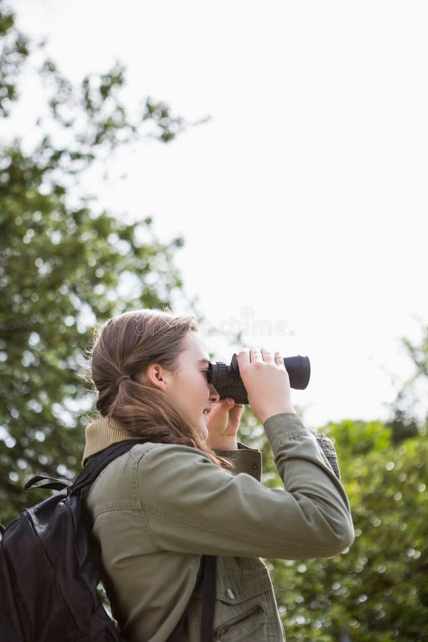 Woman using binoculars stock image. Image of person, exploration - 68298515