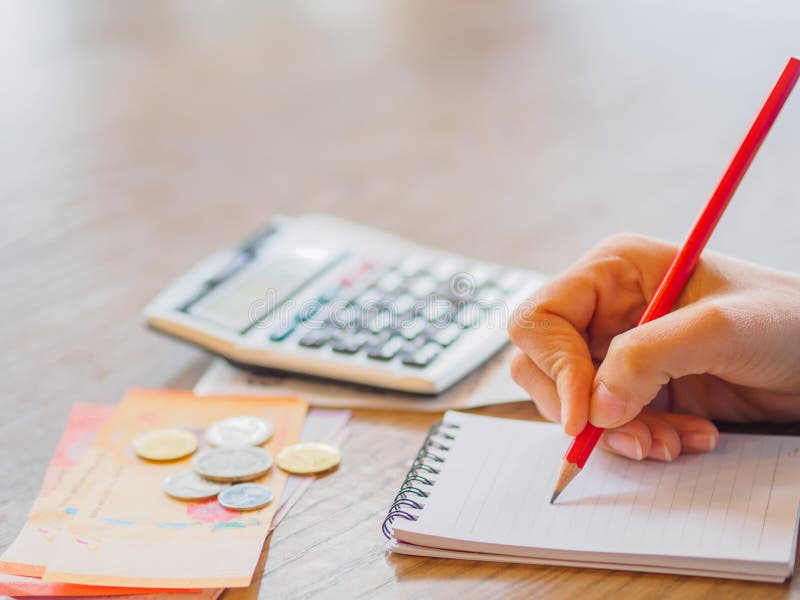 Woman Using Calculator and Thinking about Cost Stock Photo - Image of ...