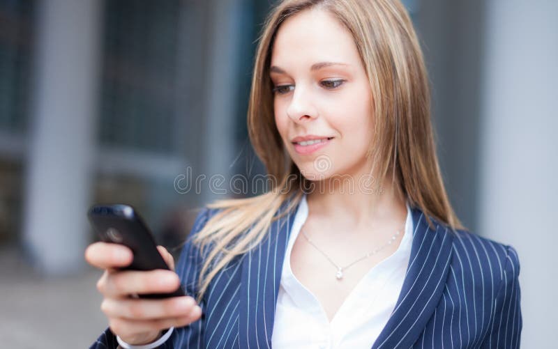 Woman using a cell phone stock image. Image of shirt - 38450969