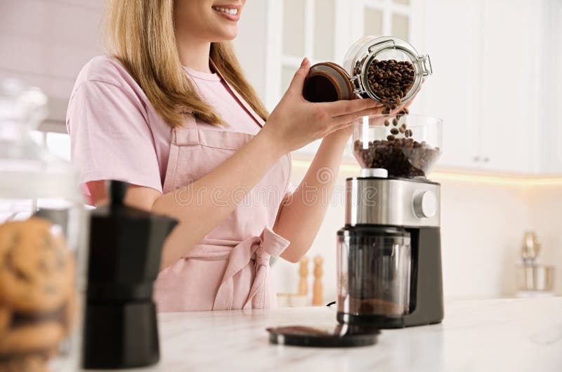 Woman Using Coffee Grinder in Kitchen, Closeup Stock Image - Image of ...