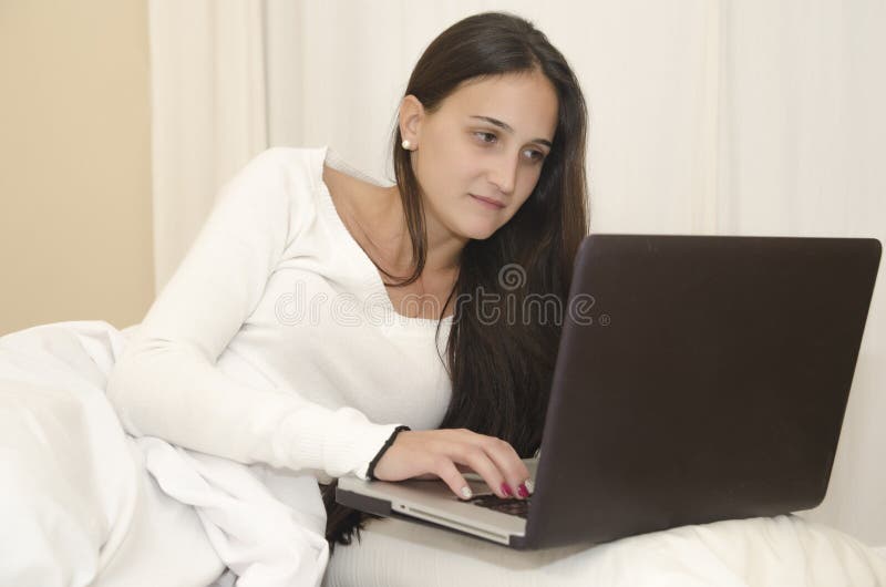 Woman Using a Computer in Bed Stock Image - Image of keyboard, savanna ...