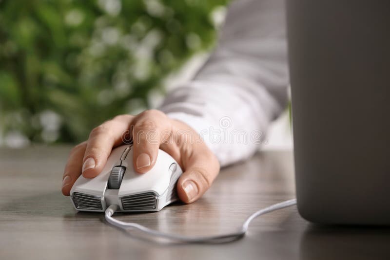 Woman Using Computer Mouse with Laptop at Table Stock Image - Image of ...