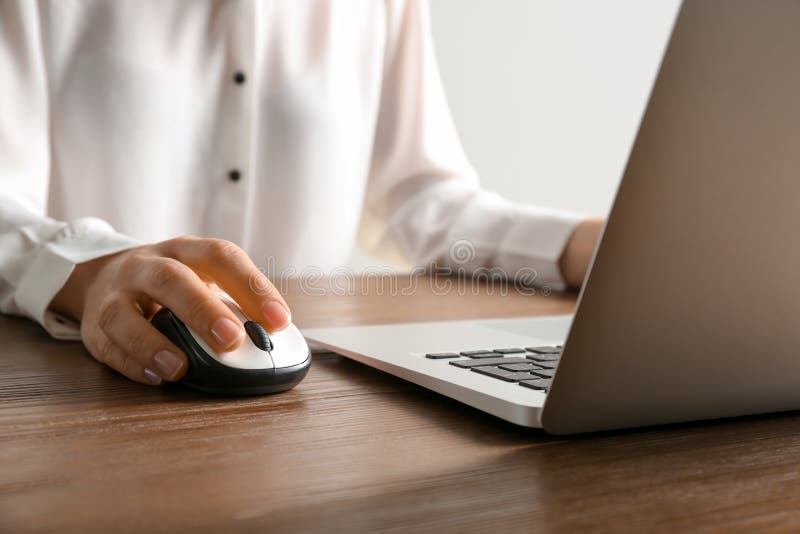 Woman Using Computer Mouse with Laptop at Table Stock Image - Image of ...