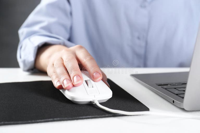 Woman Using Computer Mouse while Working with Laptop at White Table ...