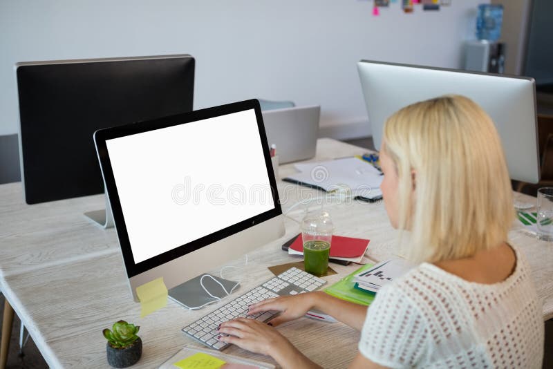Woman Using Computer while Working at Office Stock Photo - Image of ...