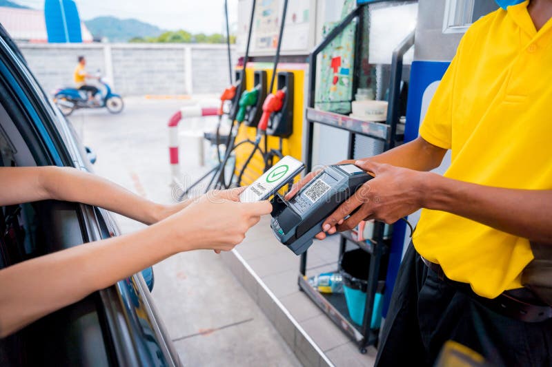 Woman Using Contactless Payment by Mobile Phone with QR Code at Car ...