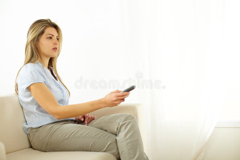 Woman Using a Control Remote Stock Image - Image of control, attractive ...