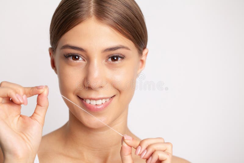 Woman Using Dental Floss for Cleaning Her Teeth Stock Photo - Image of flossing, portrait: 278022958