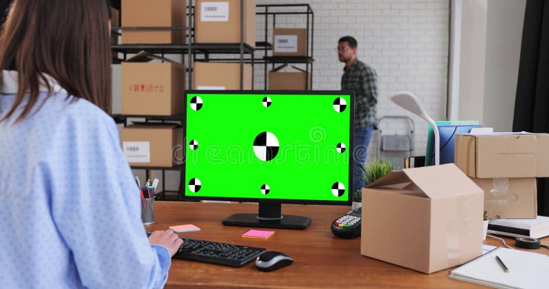 Woman Using Desktop Computer with Green Screen Color Display. Woman and ...