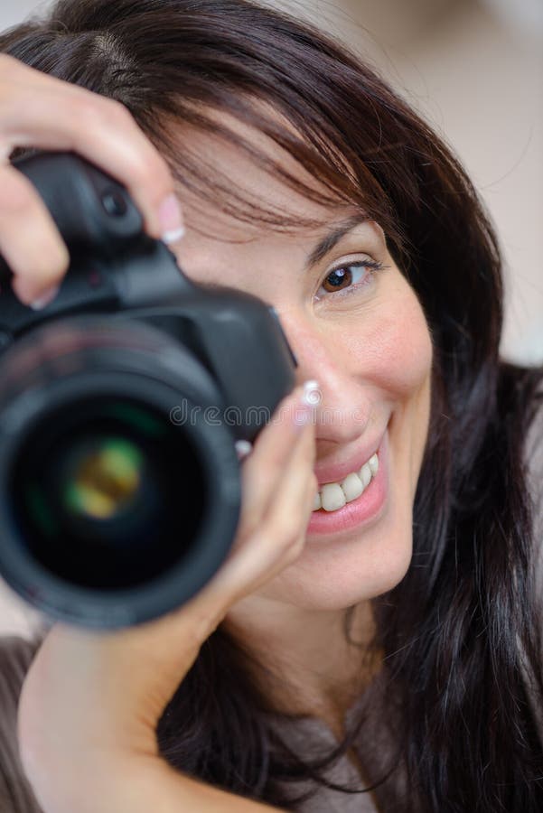 Woman using digital camera stock photo. Image of moment - 93064040