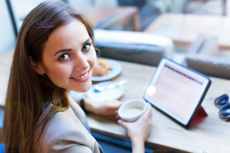 Woman Using Digital Tablet in Cafe Stock Photo - Image of drinking ...