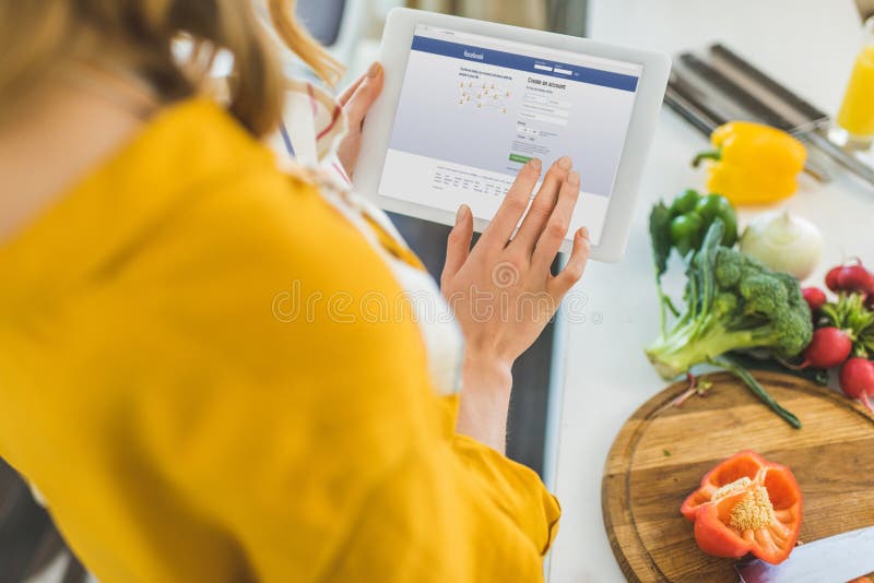 Woman Using Digital Tablet in Kitchen for Recipe Editorial Photo ...