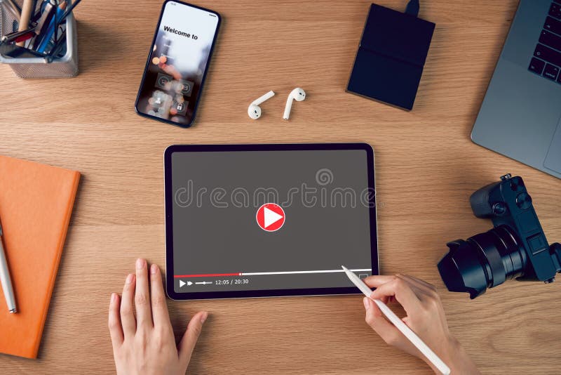 Woman Using Digital Tablet and Watching Video Online with Camera and ...