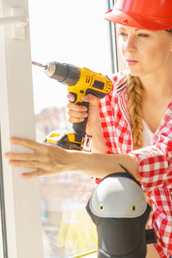 Woman Using Drill To Fix or Installing Windows Stock Photo - Image of ...